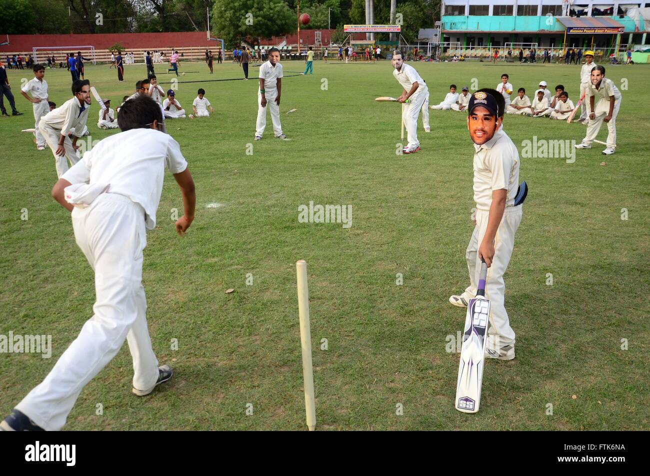 Children wear mask of Indian Cricket players during their practice for ...