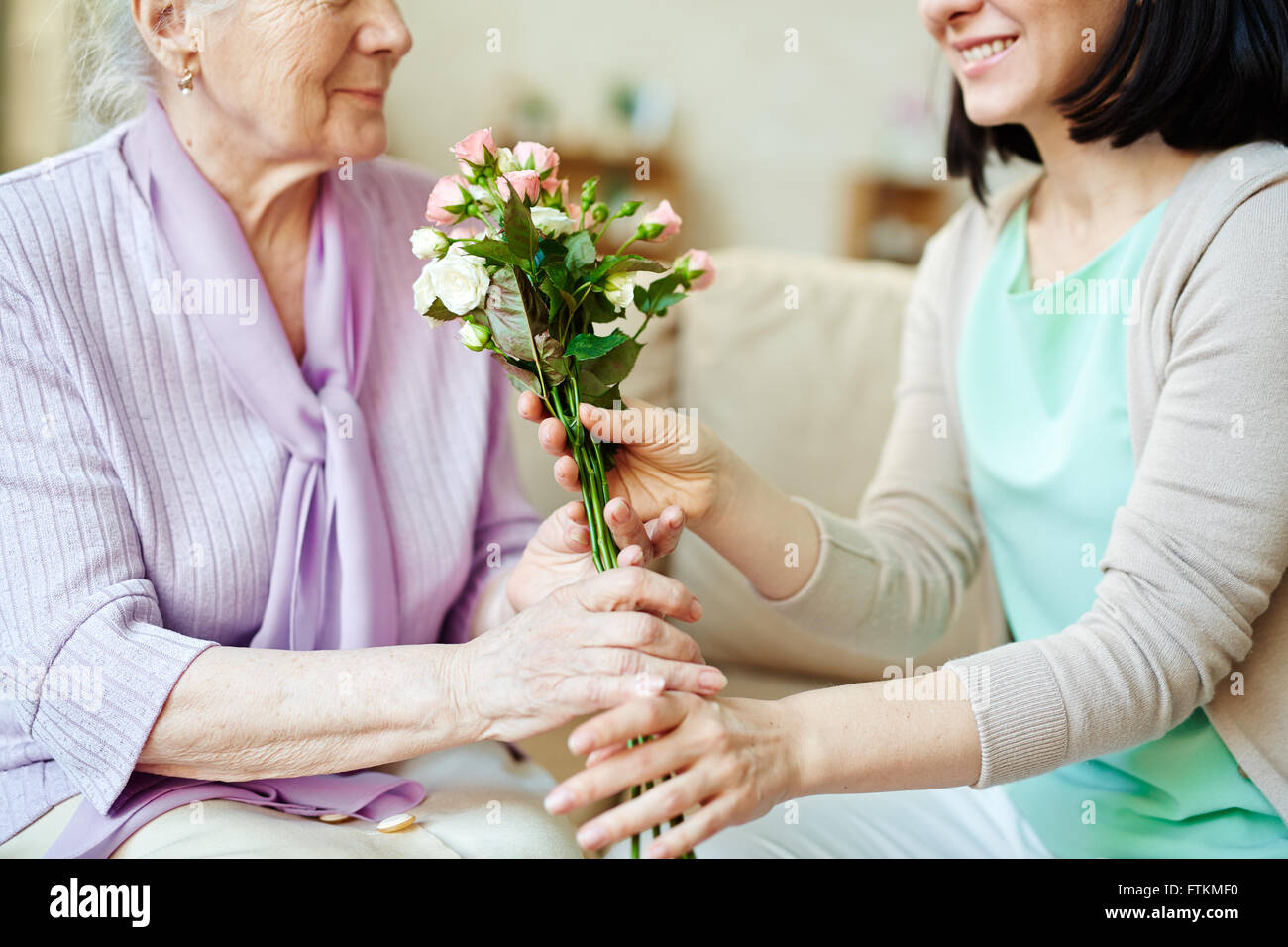 Giving fresh roses Stock Photo - Alamy