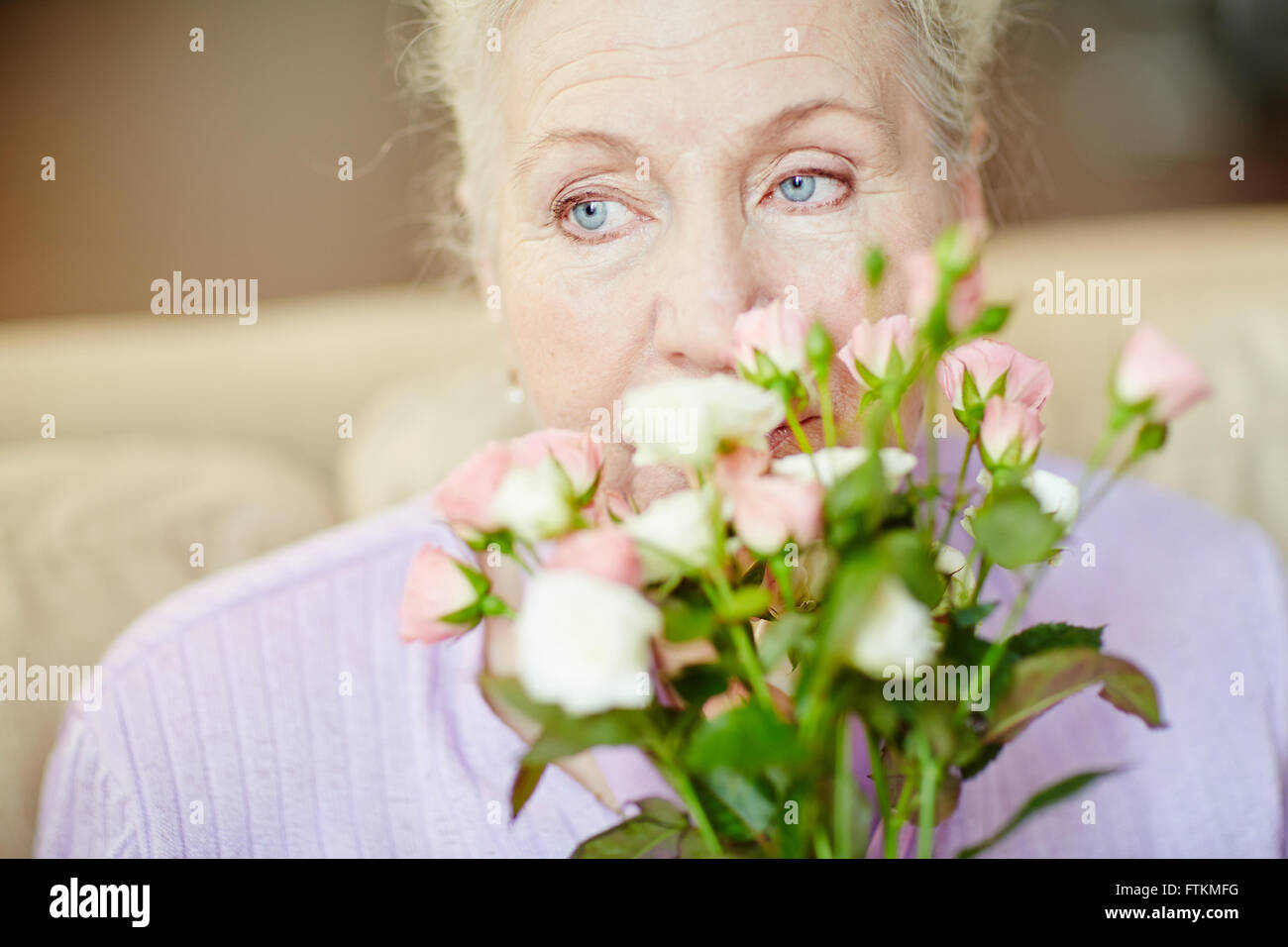 Woman smelling bouquet rose hi-res stock photography and images - Alamy