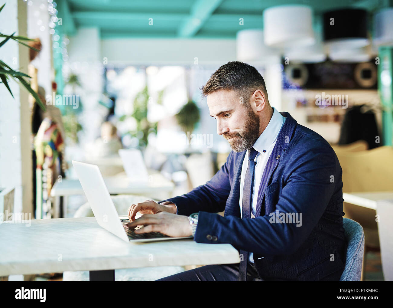Browsing on laptop Stock Photo - Alamy