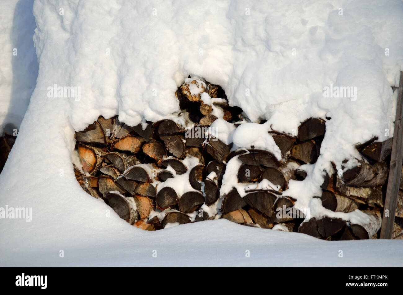 snow covered firewood stack Stock Photo - Alamy