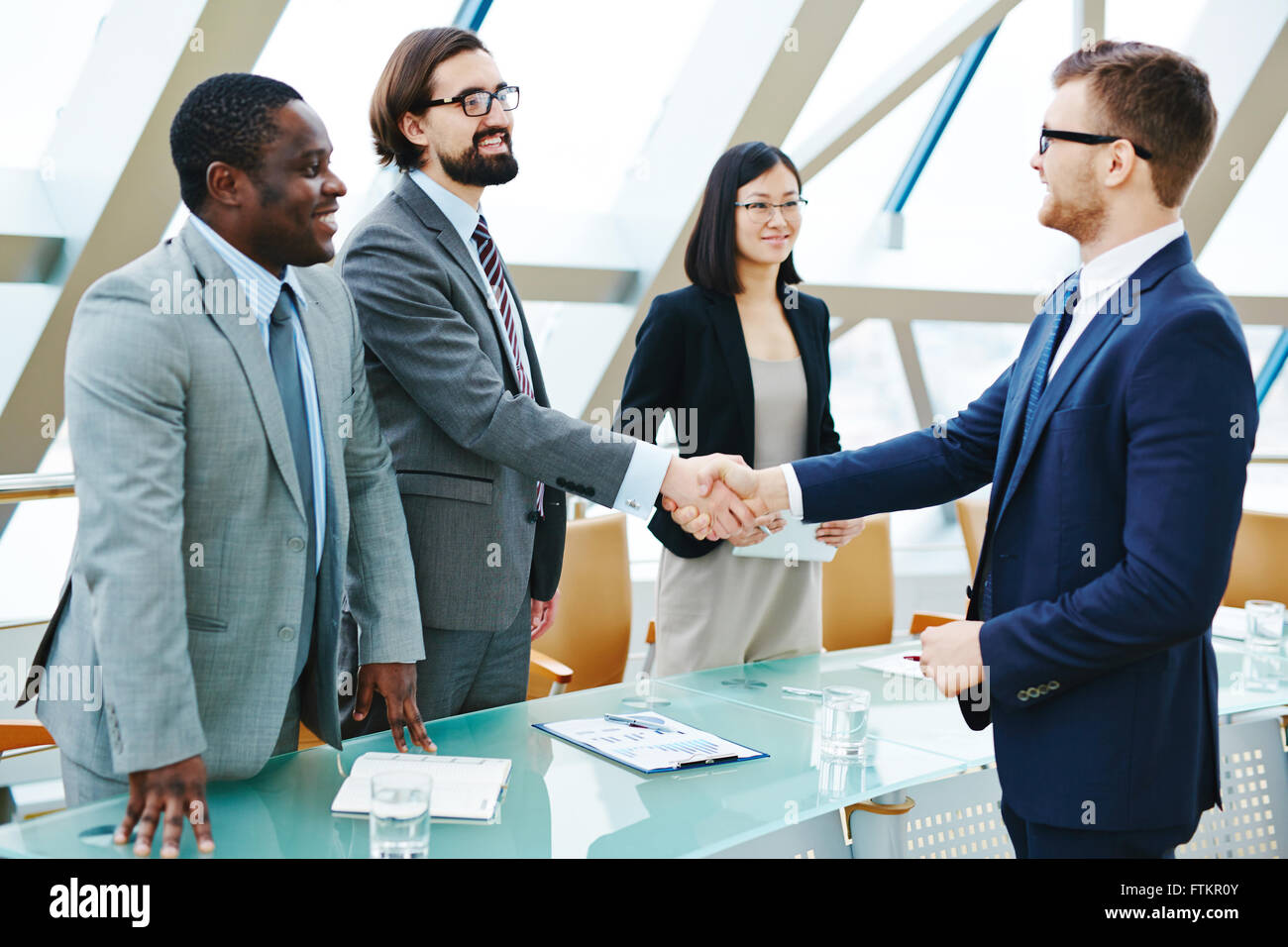 Handshake with new partner Stock Photo - Alamy