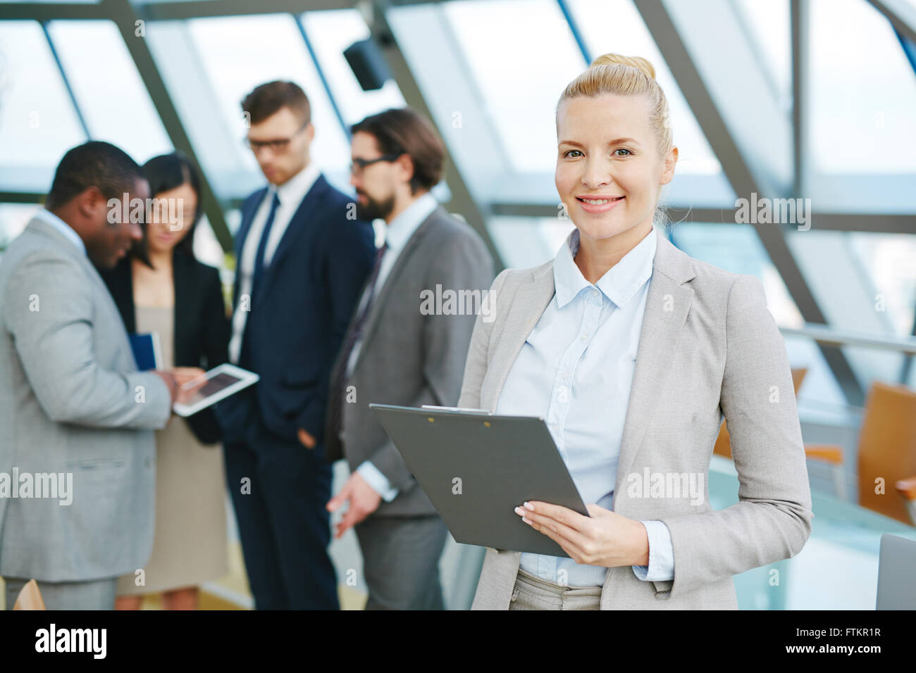 Secretary with clipboard Stock Photo - Alamy