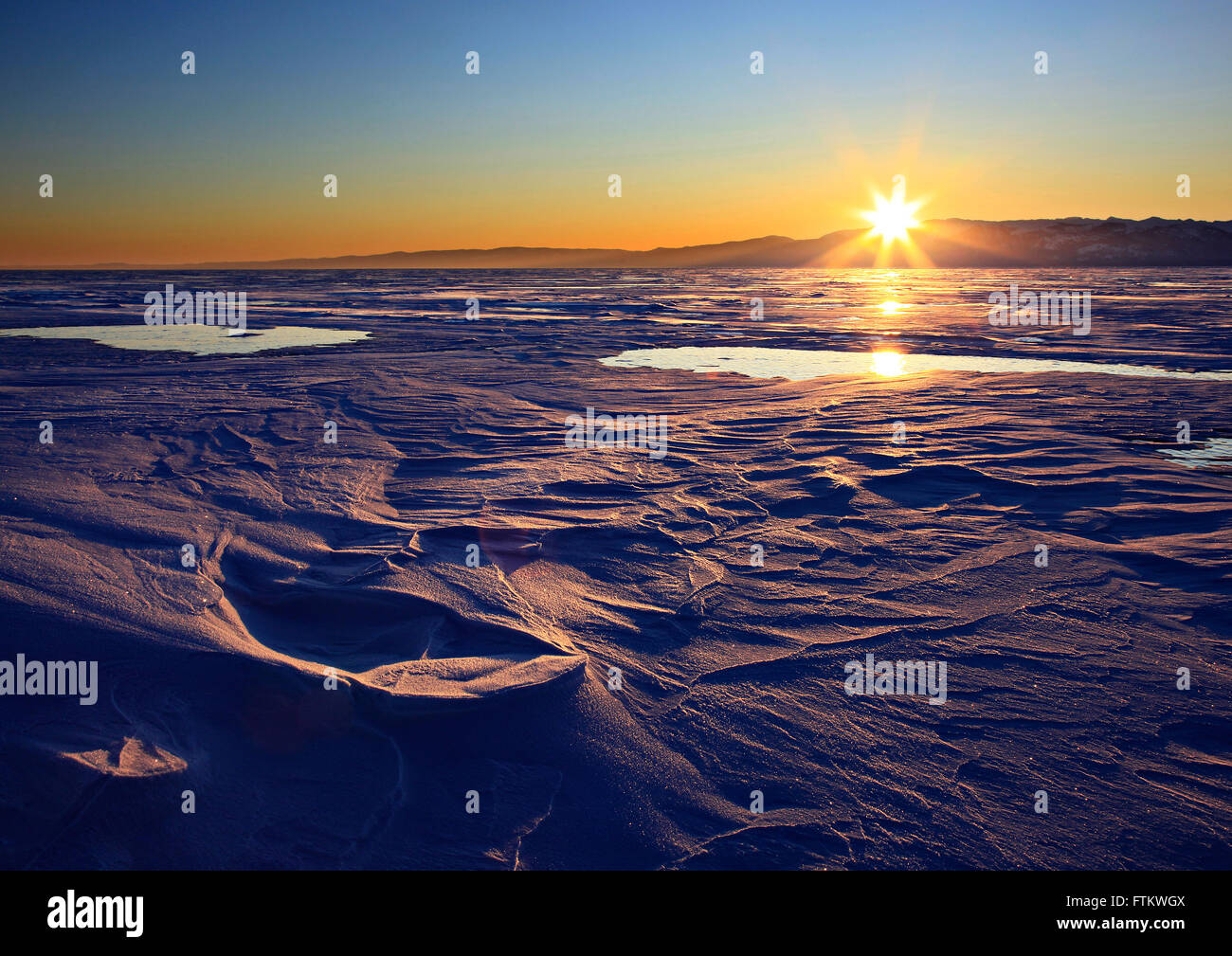 Surface of snow on ice of The Baikal Lake in winter Stock Photo - Alamy