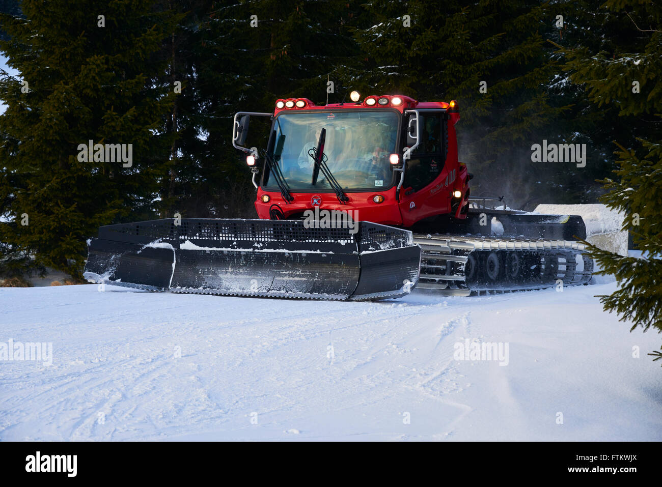 Snowcat on a snowy mountain Stock Photo - Alamy