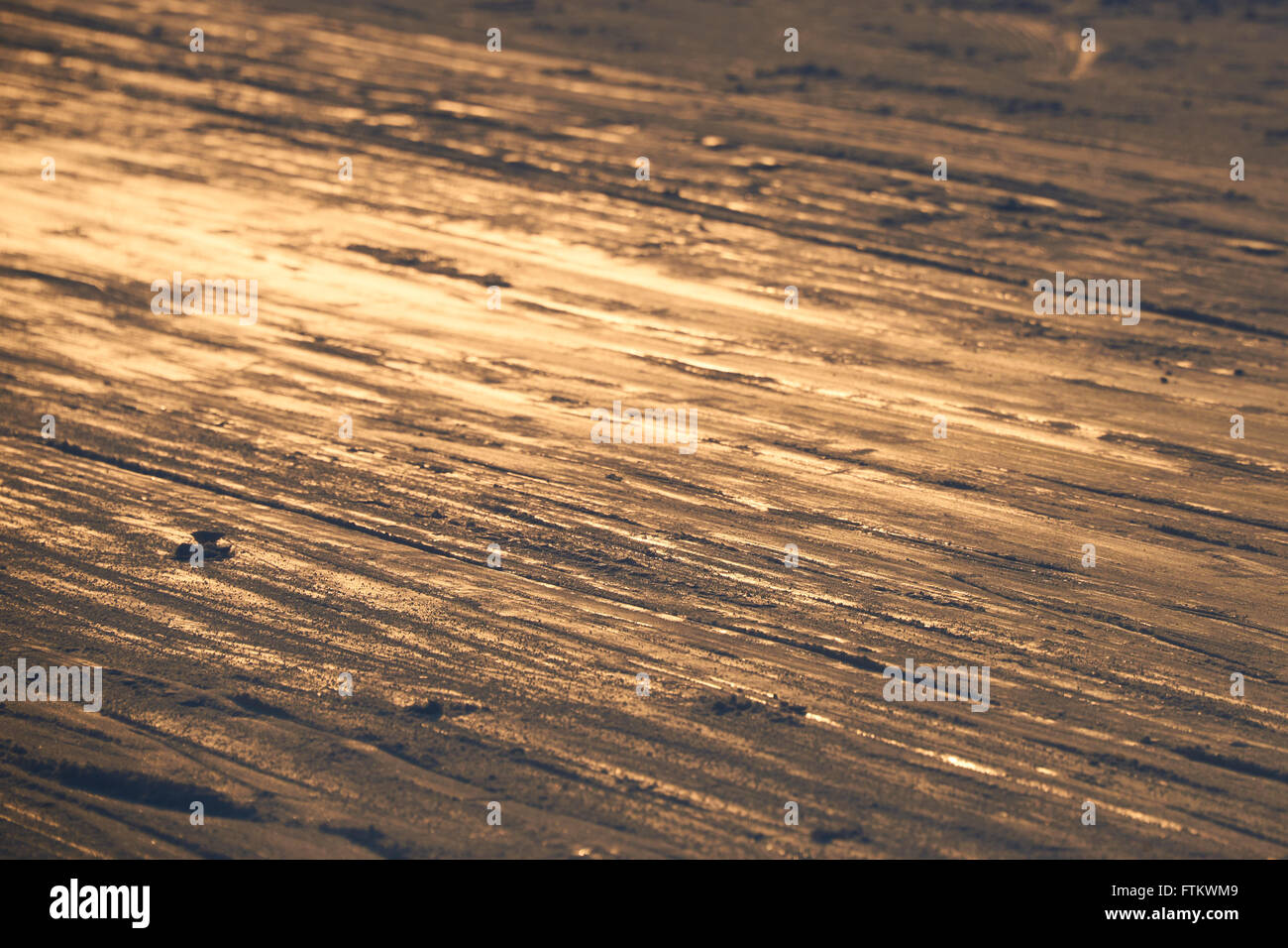 Skiing background - downhill ski tracks on ski slope - ski trails on ...