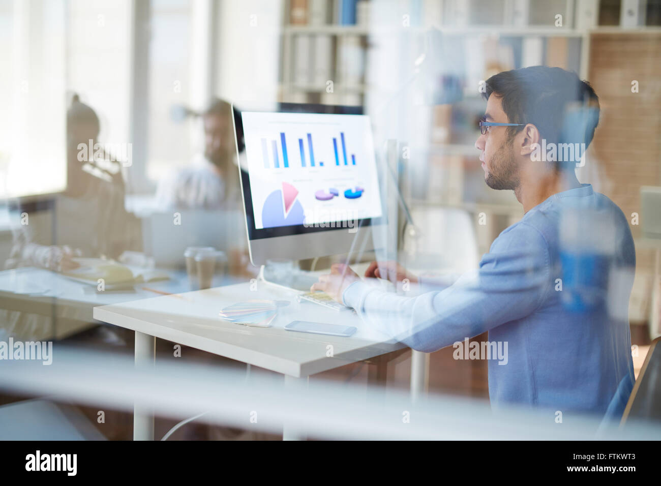 Man at workplace Stock Photo - Alamy