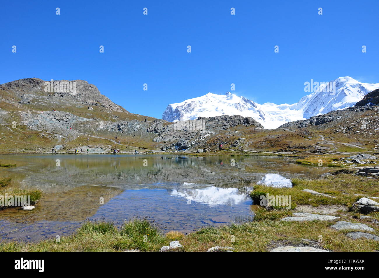 Alpine scene showing reflections of glacier peak in mountain lake Stock ...