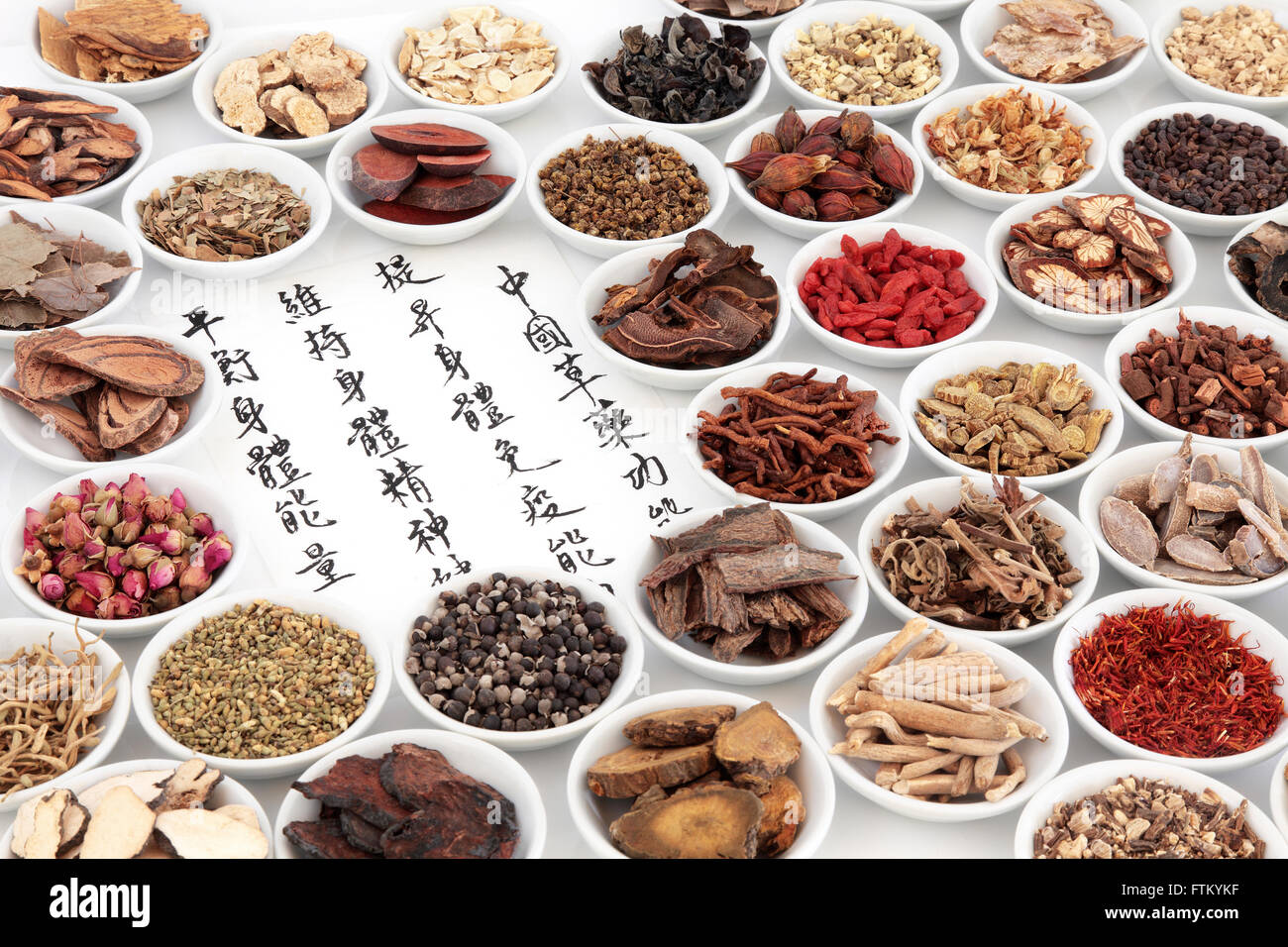 Chinese herbal medicine ingredients with calligraphy on rice paper ...