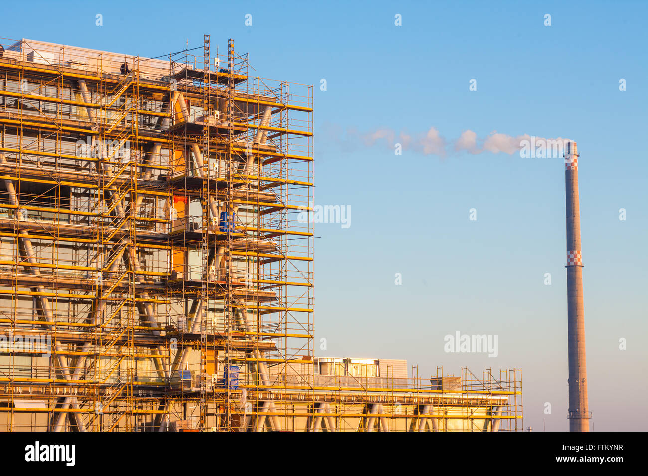 Modern building under construction with blue sky Stock Photo - Alamy