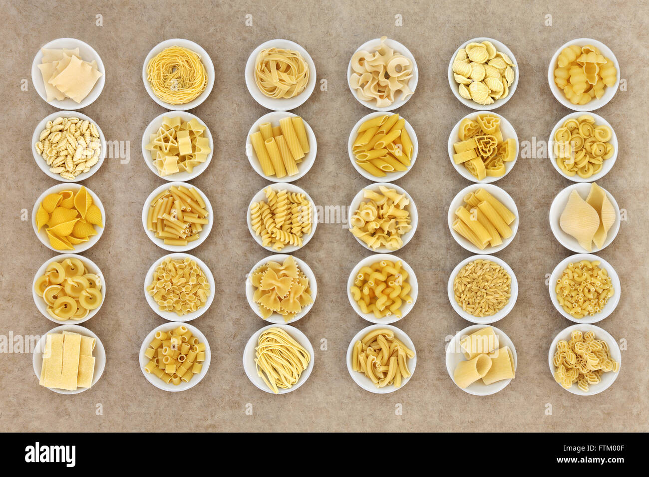 Italian dried food pasta selection in round porcelain bowls over ...