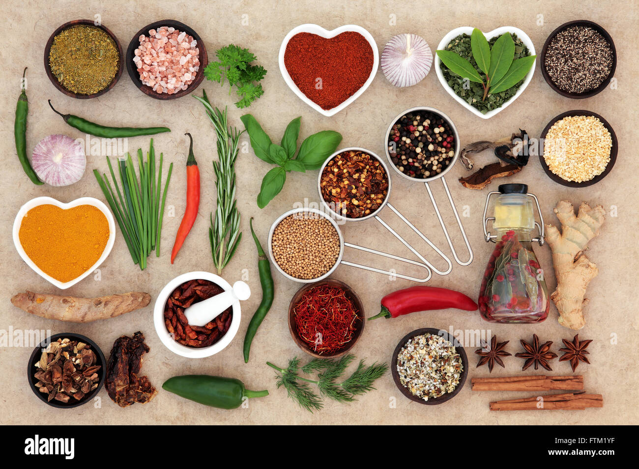 Food seasoning with herb and spice selection and chili olive oil over ...