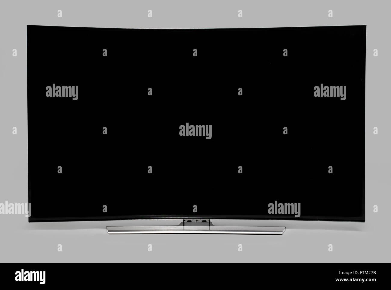 Curved Widescreen TV on grey background Stock Photo - Alamy