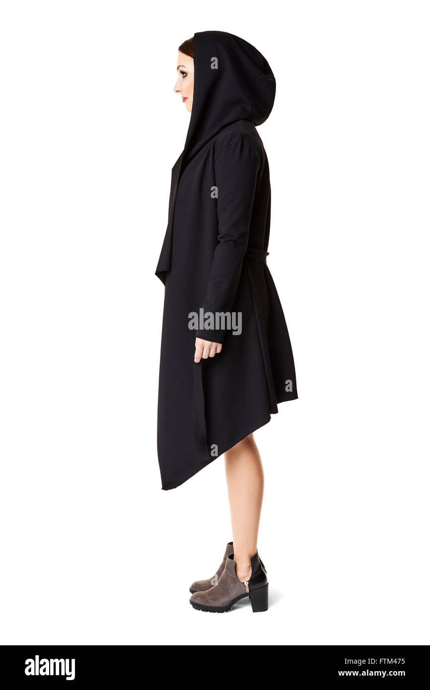 Side view of woman in black coat. Isolated on white background Stock ...