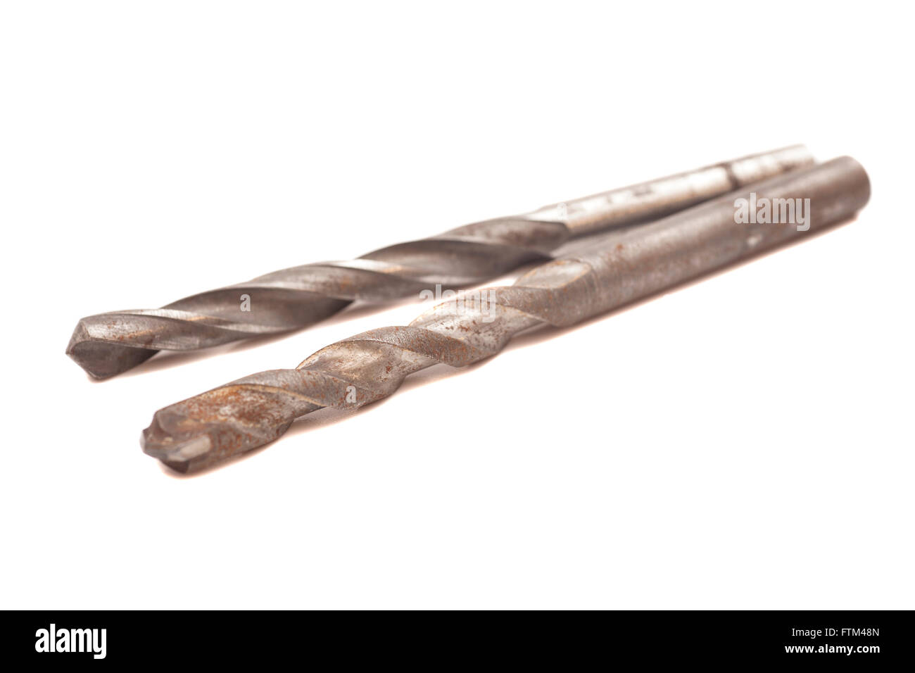Two Drill bits isolated on white background Stock Photo - Alamy