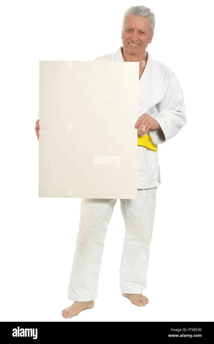 Karate Senior man with poster Stock Photo - Alamy