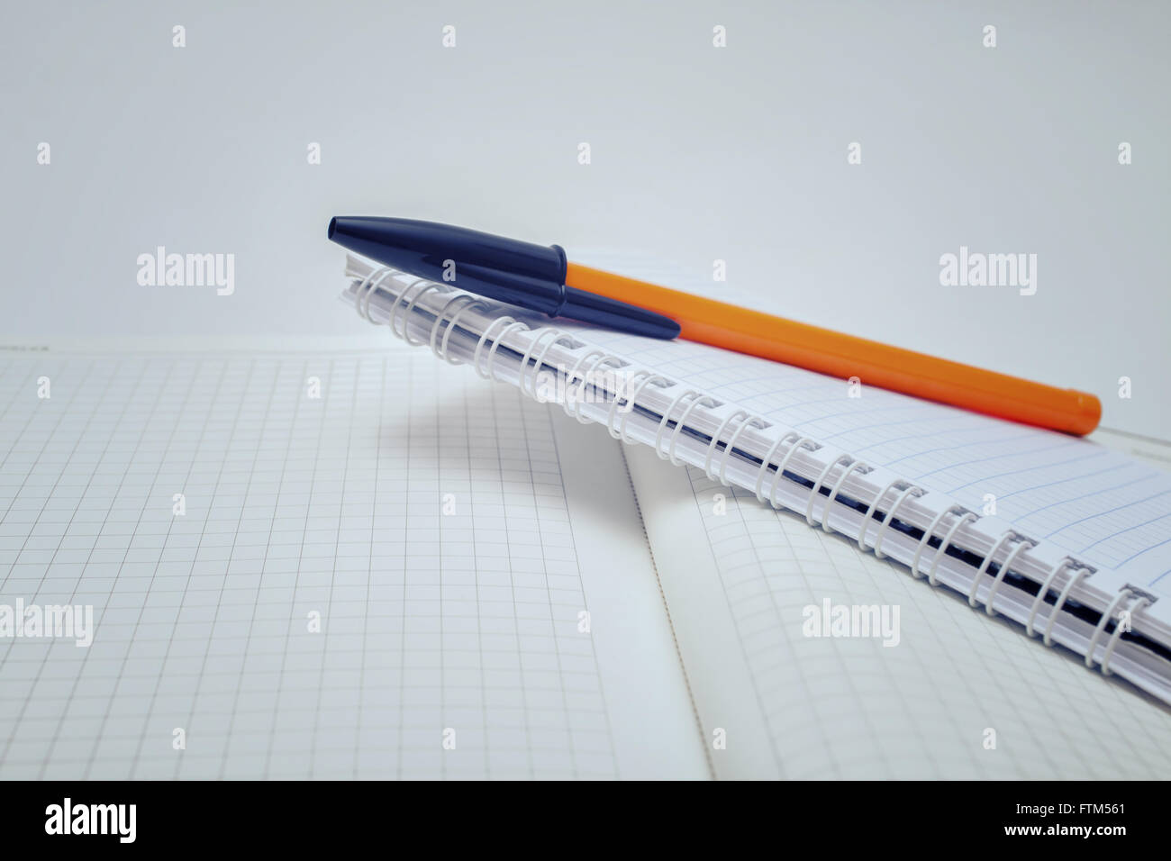 Yellow ballpen and two notebook closeup Stock Photo - Alamy