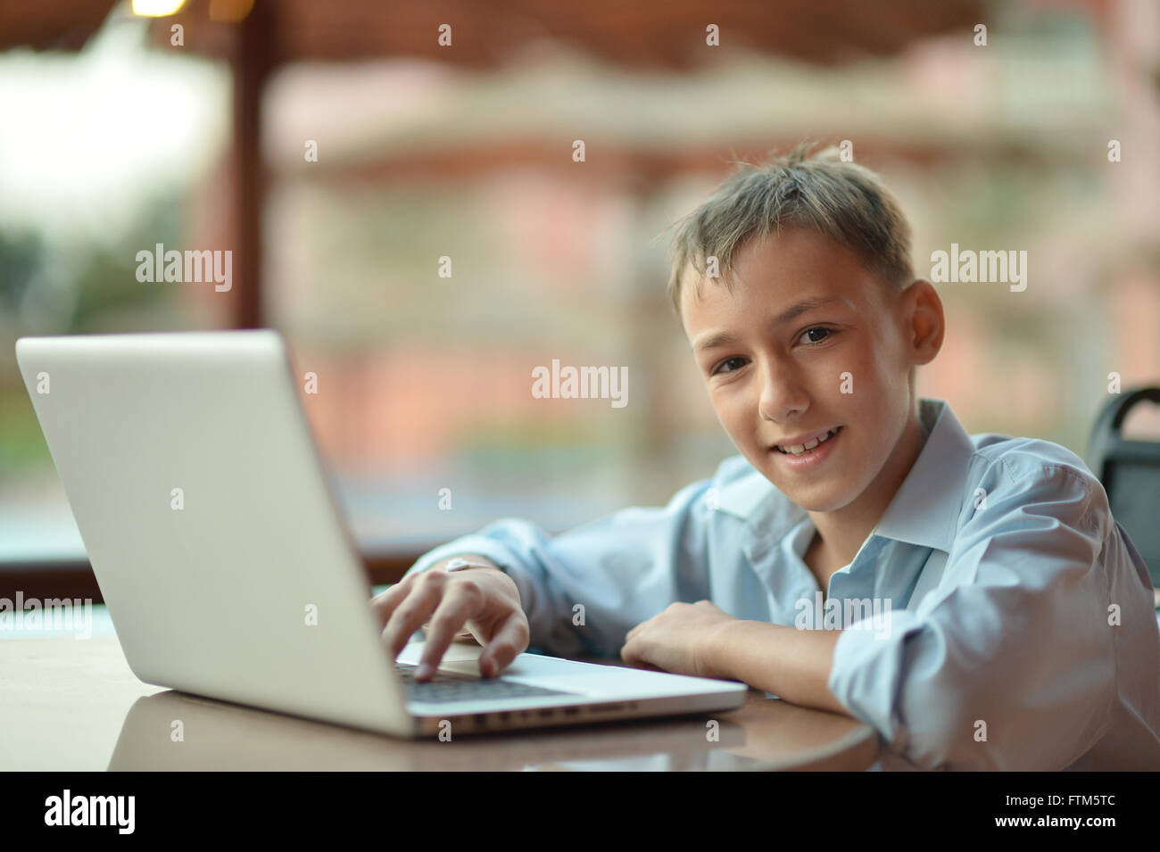 boy sitting with laptop Stock Photo - Alamy