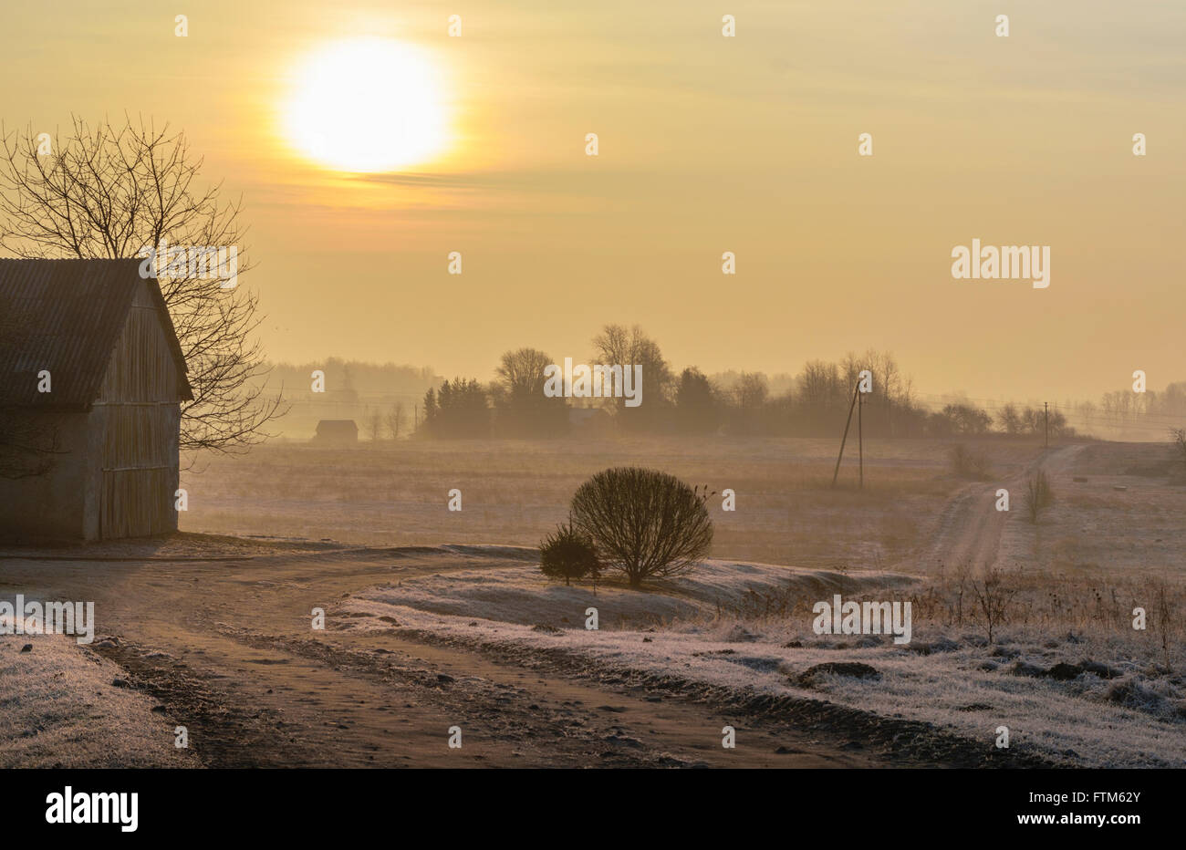 Countryside during the sunrise in early springtime when the land is ...