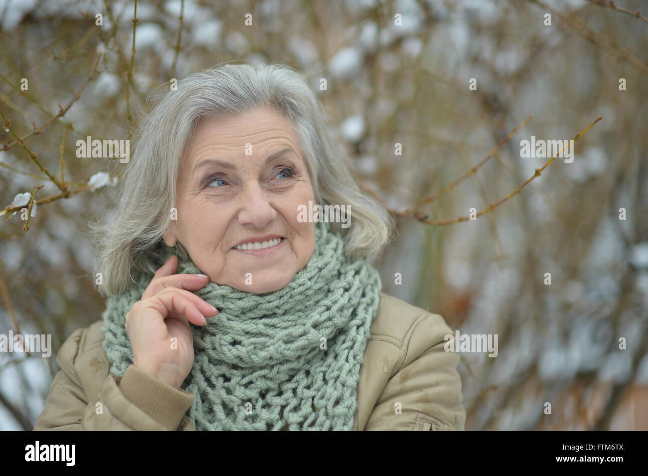 Old woman in the winter Stock Photo - Alamy