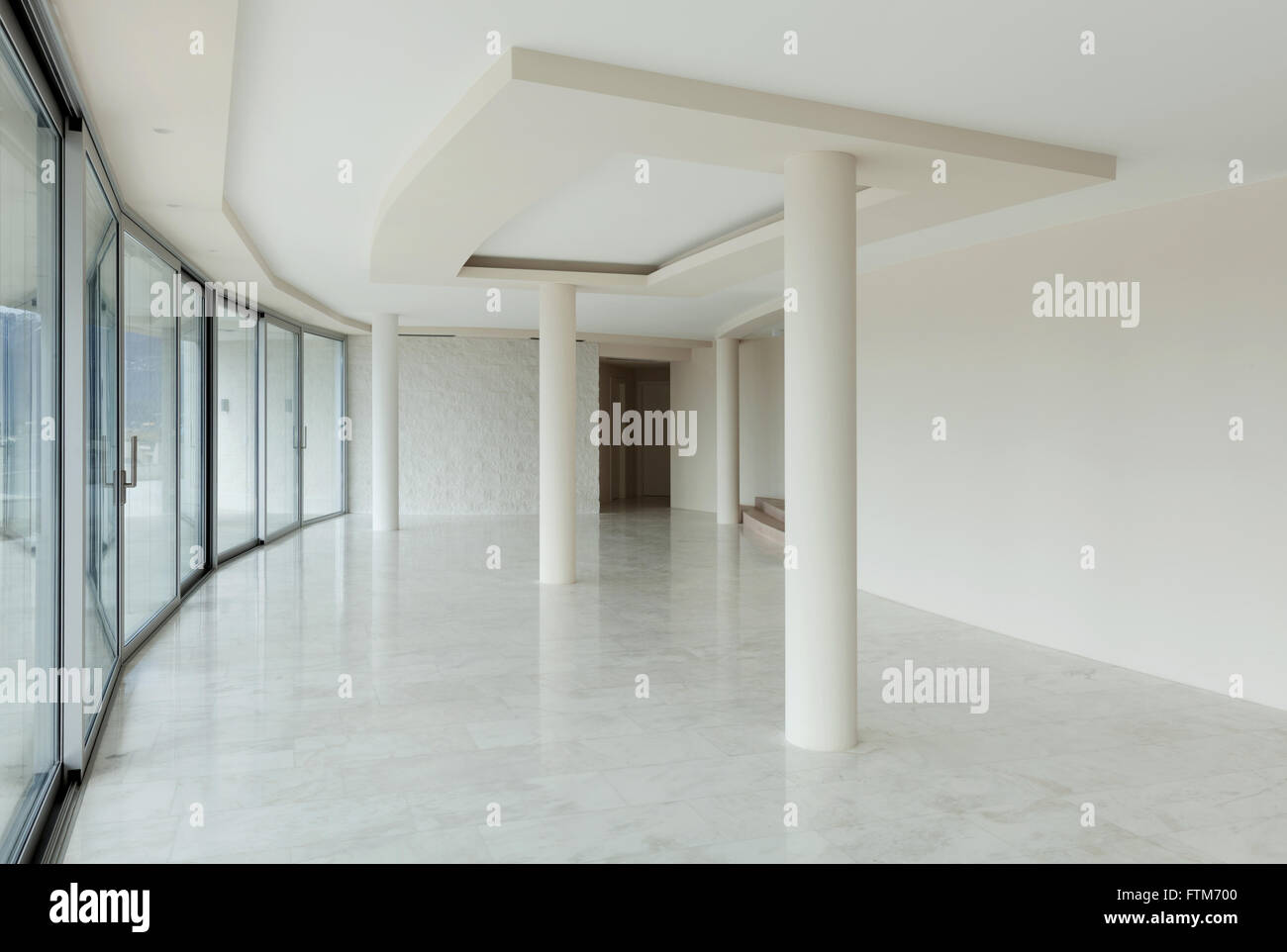 Interior of a modern building, wide room with cement columns Stock ...