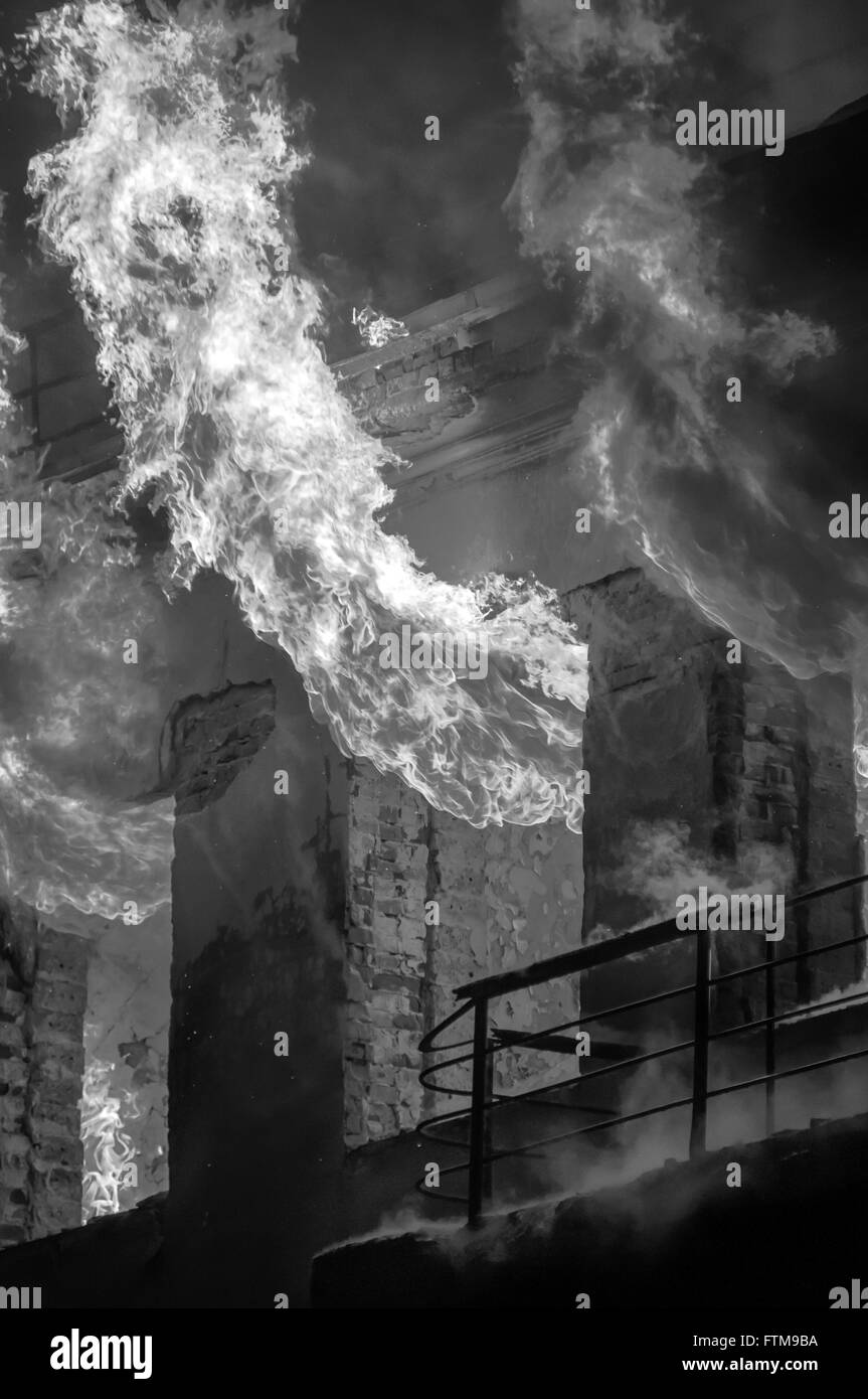 Flames of fire in the window of a burning house Stock Photo - Alamy