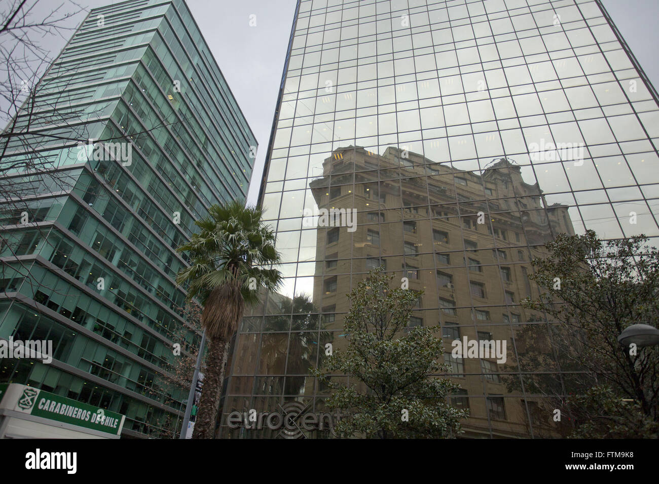 Buildings of modern architecture with reflection of historic building ...