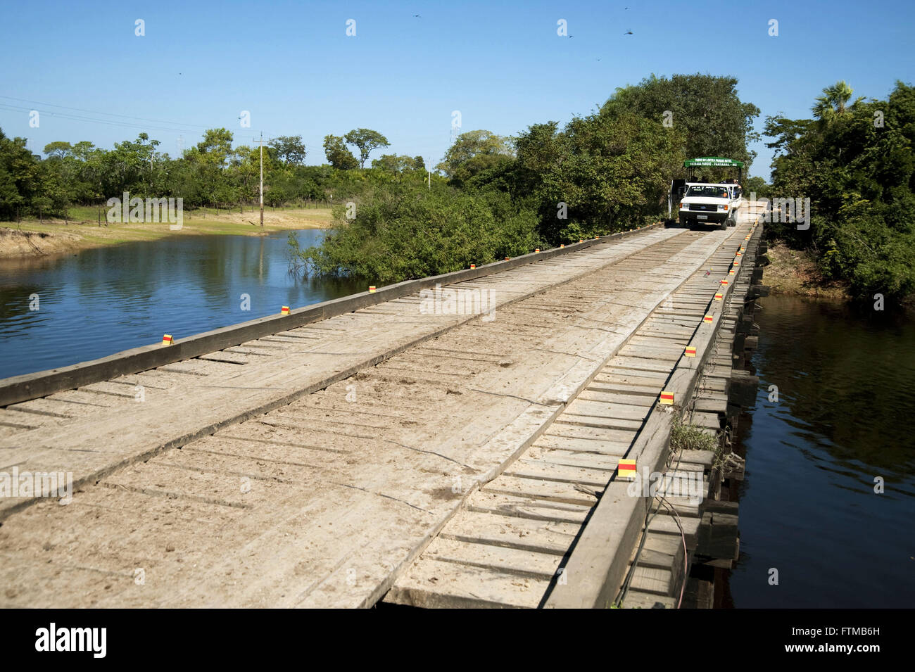 Tourist car ride across the wooden bridge over Rio Miranda Stock Photo ...