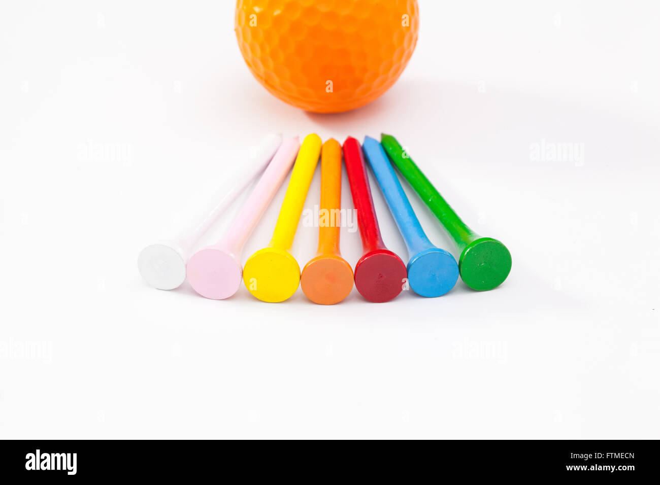 Wooden golf tees on the white background Stock Photo - Alamy