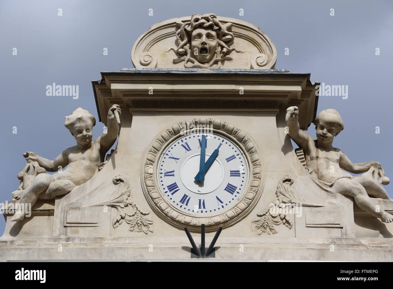 Old clock of an classical building of Paris Stock Photo - Alamy