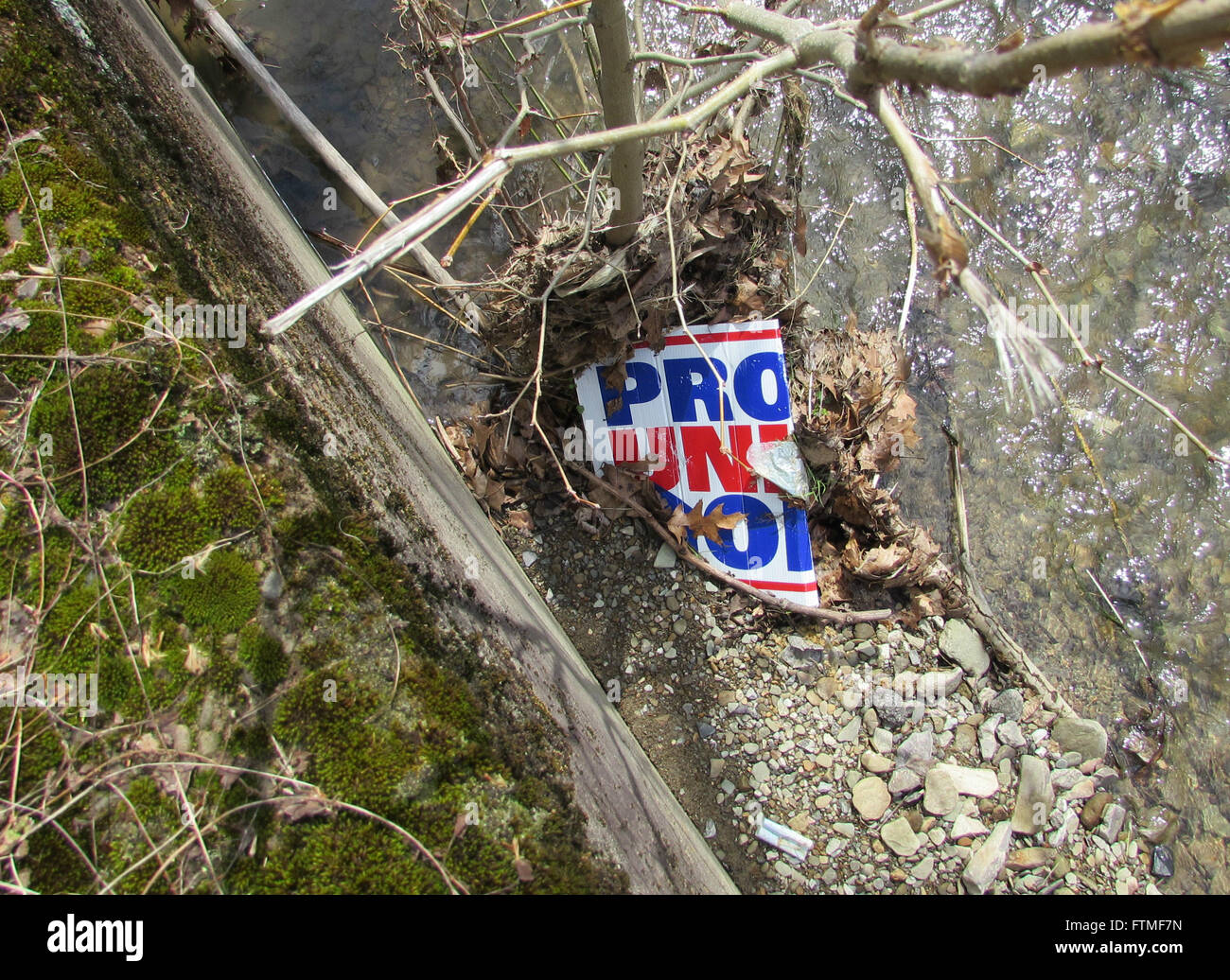 A discarded Proud Union Home sign in a creek in Wheeling, West Virginia ...
