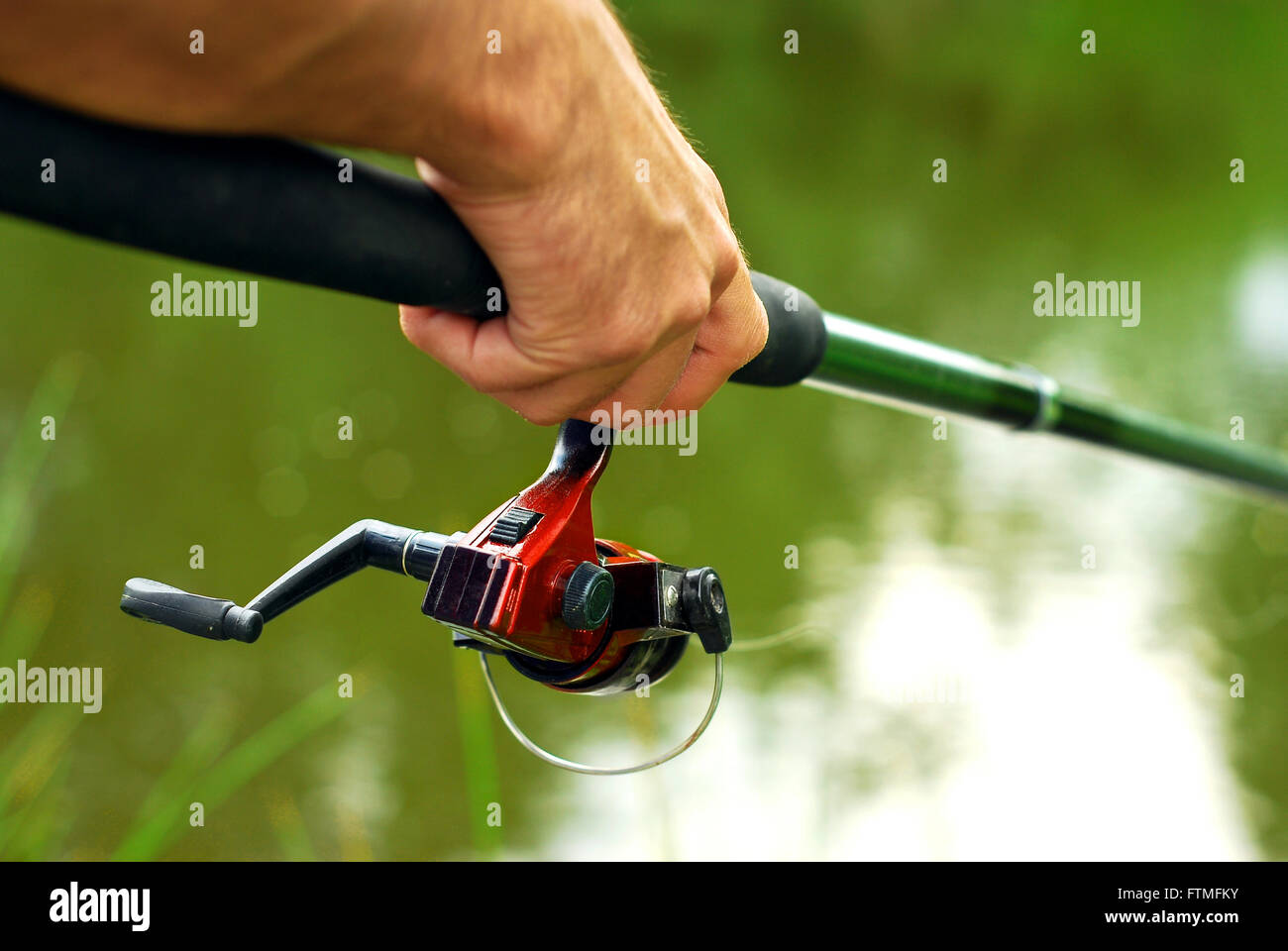 fishing angler hand Stock Photo - Alamy