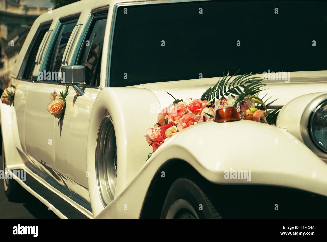 White wedding limousine decorated with flowers Stock Photo - Alamy