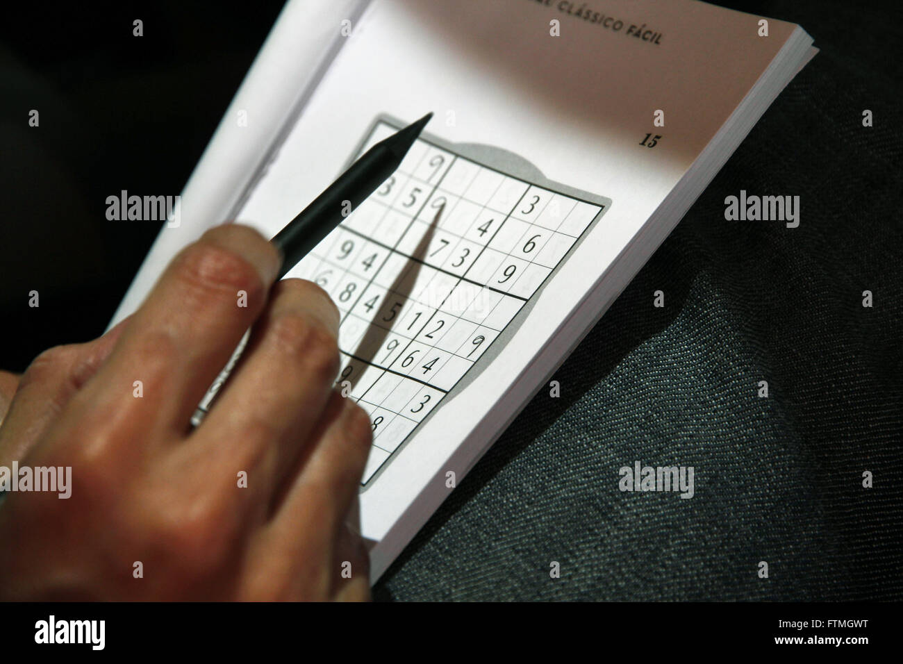 Person playing sudoku Stock Photo - Alamy