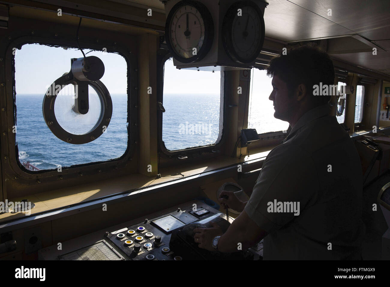 Helmsman on the bridge of the ship Maisa - tanker PETROBRAS Stock Photo ...