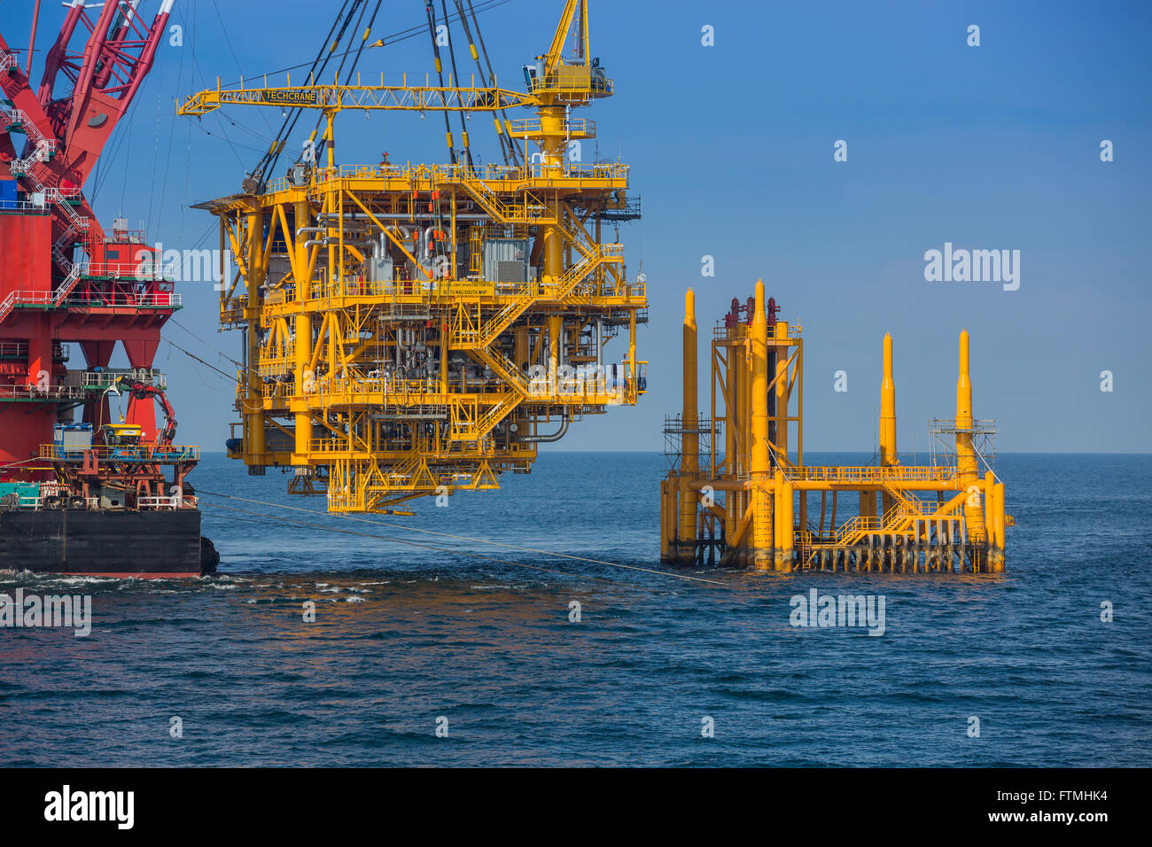 Oil rig lifting for installation on its jacket Stock Photo - Alamy