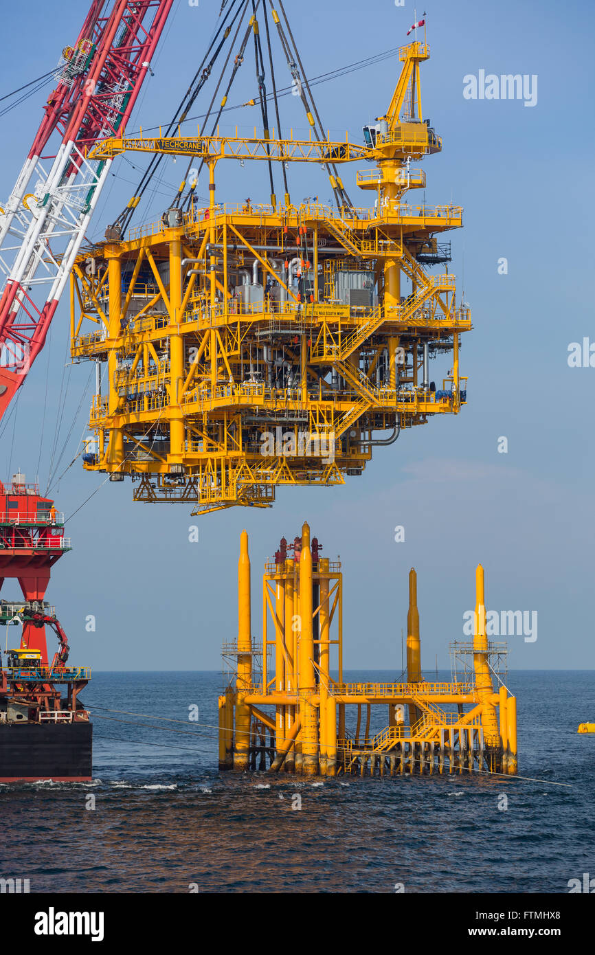 Oil rig lifting for installation on its jacket Stock Photo - Alamy