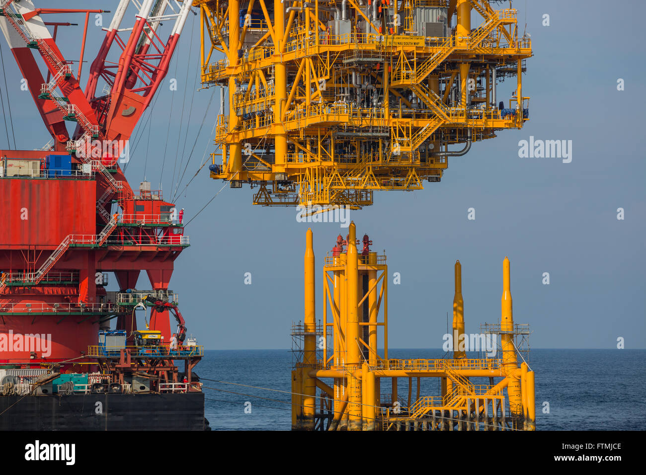Oil rig lifting for installation on its jacket Stock Photo - Alamy