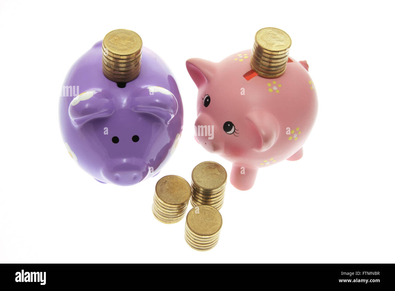 Piggy Banks with Coins Stock Photo - Alamy