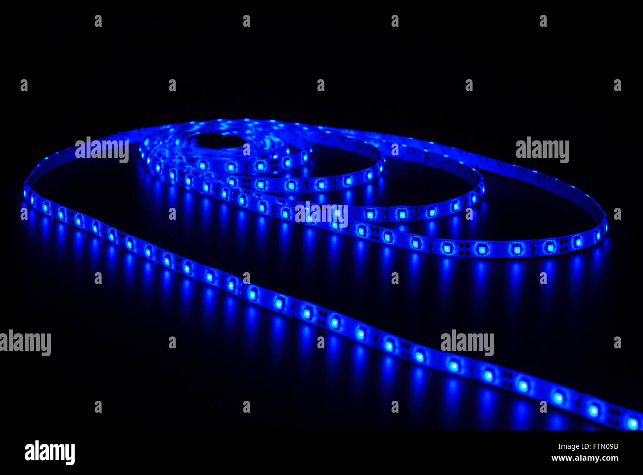 Blue led strip on the black background Stock Photo - Alamy