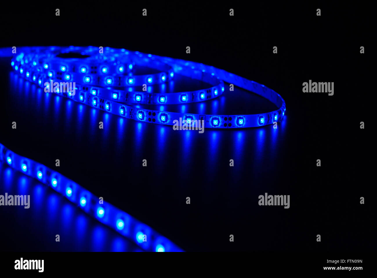 Blue led strip on the black background Stock Photo - Alamy
