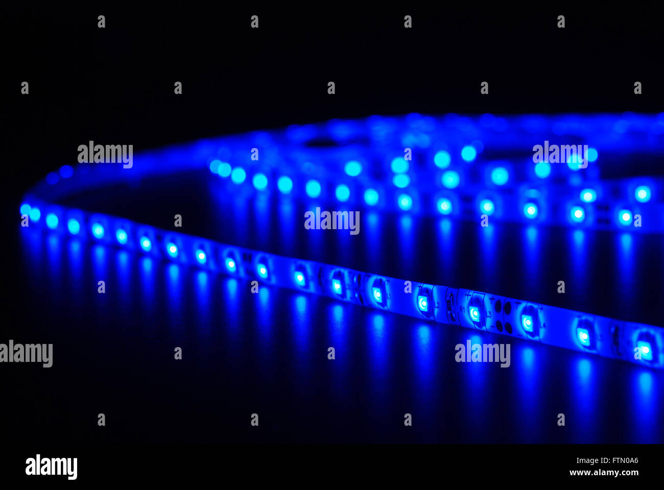 Blue led strip on the black background Stock Photo - Alamy