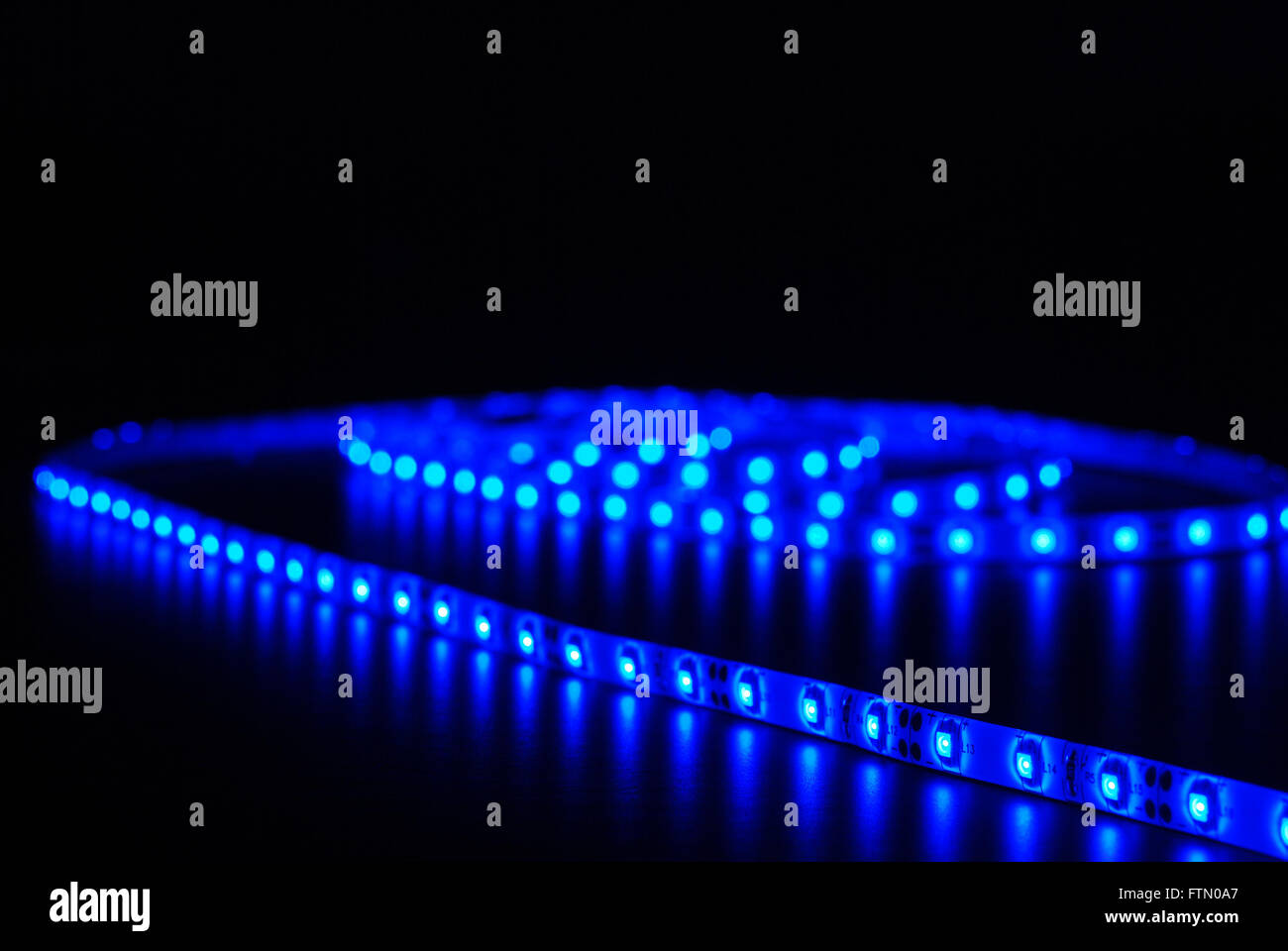 Blue led strip on the black background Stock Photo - Alamy