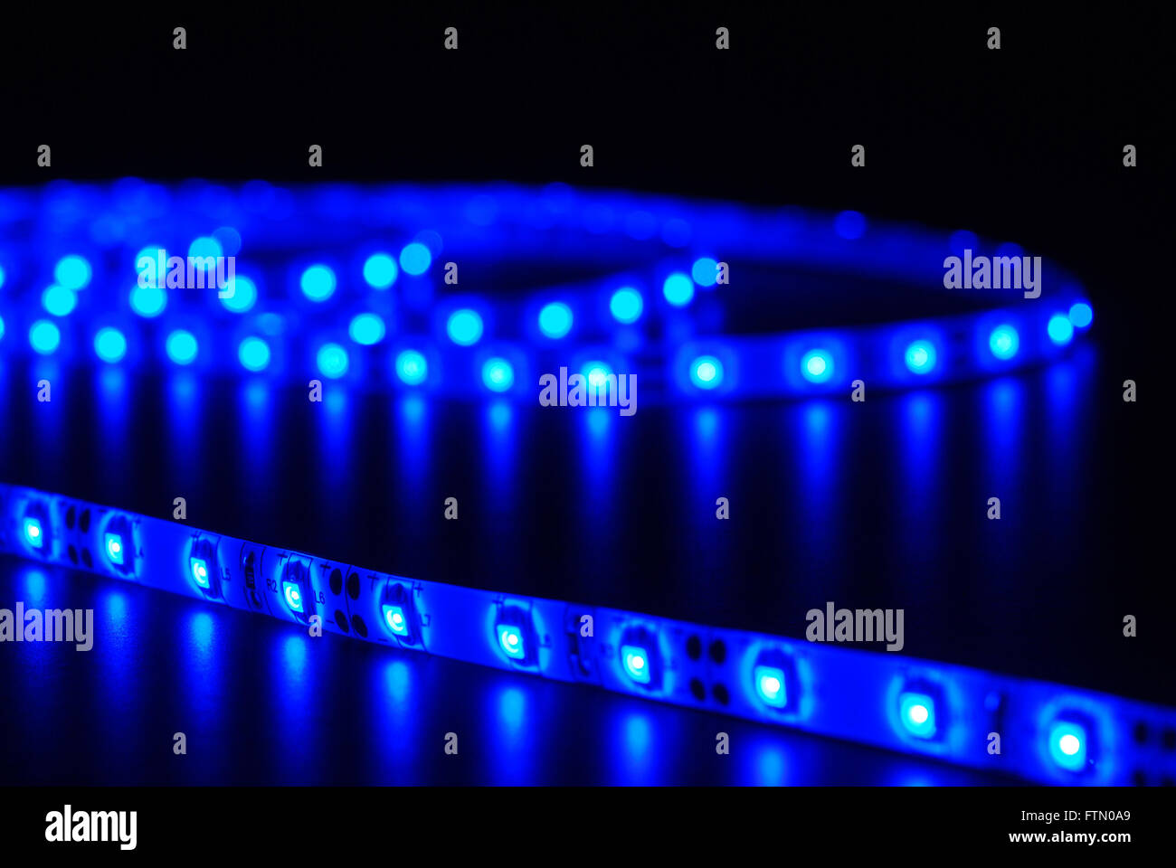 Blue led strip on the black background Stock Photo - Alamy