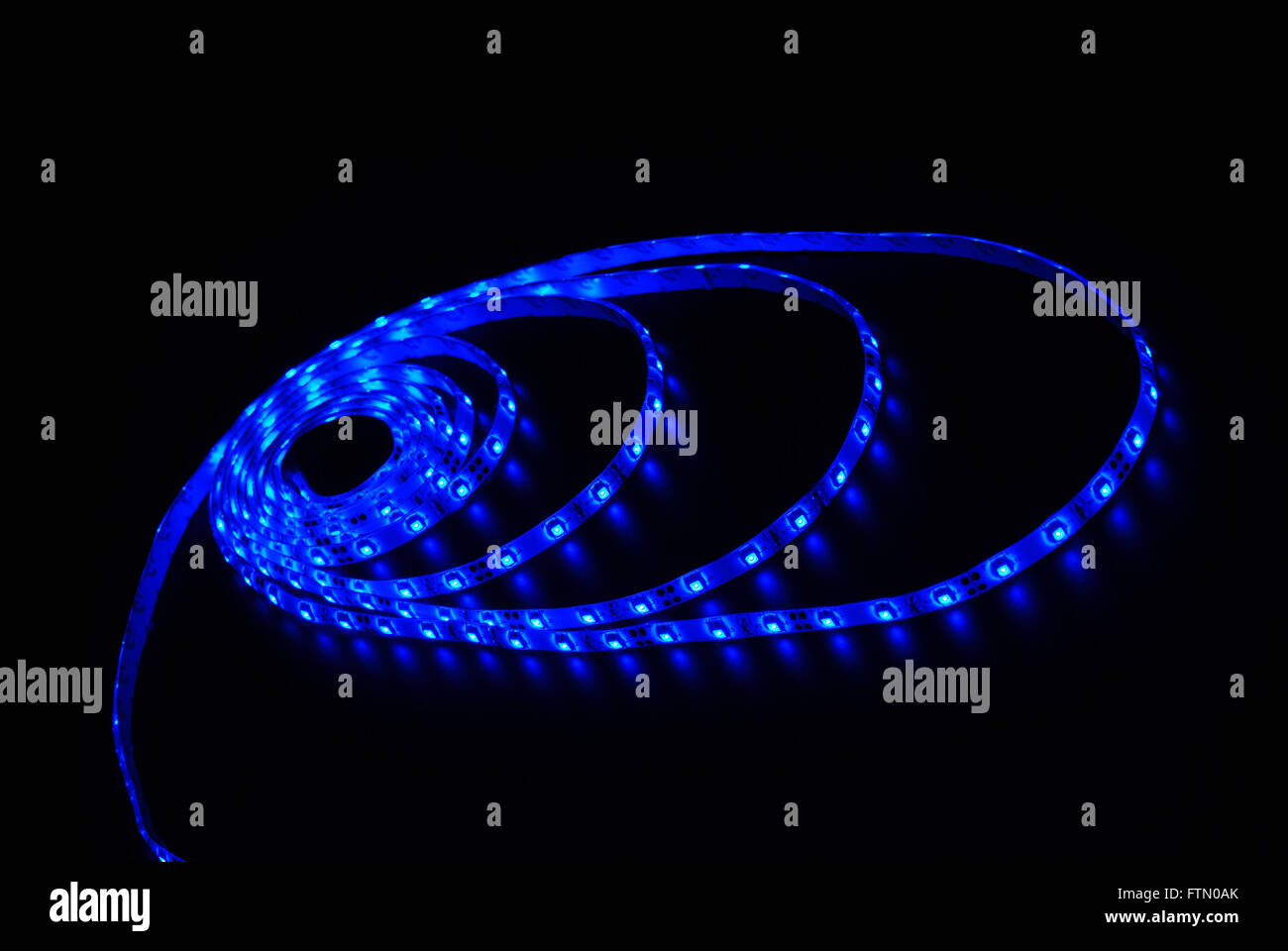 Blue led strip on the black background Stock Photo - Alamy