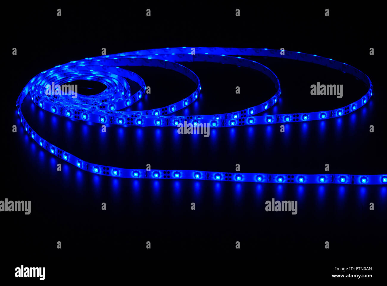 Blue led strip on the black background Stock Photo - Alamy
