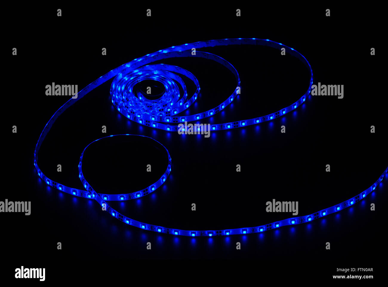 Blue led strip on the black background Stock Photo - Alamy