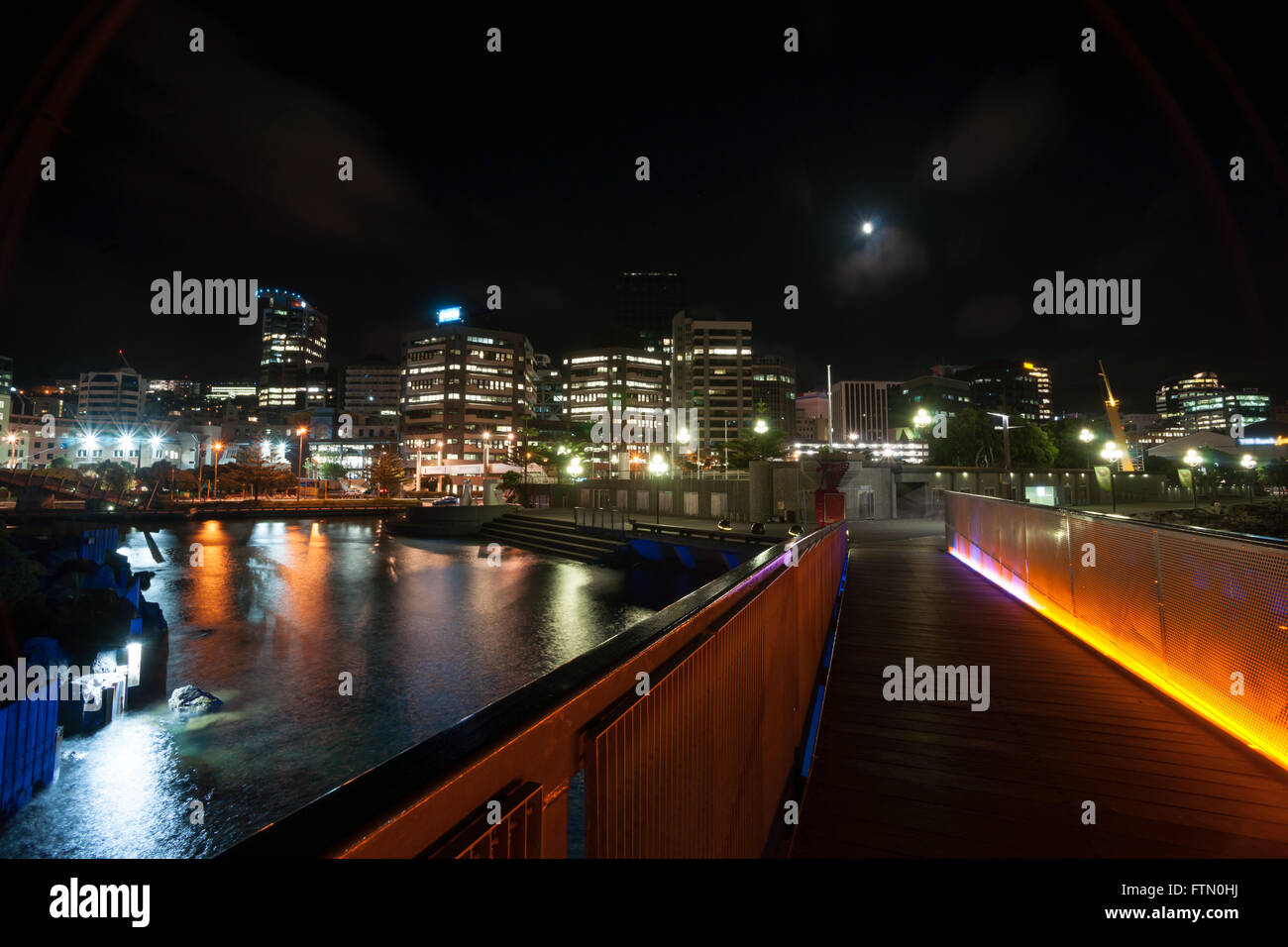 City lights across bay around illuminated walkway Wellington New ...