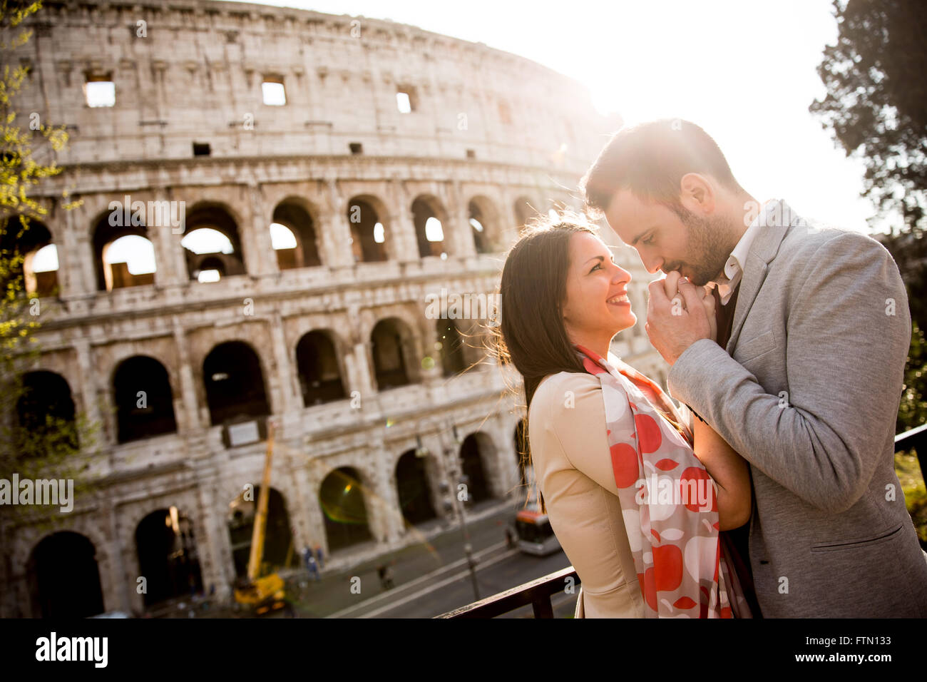 Loving couple in front of the Colosseum in Rome Stock Photo - Alamy