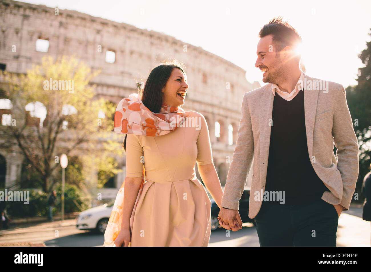 Loving couple in front of the Colosseum in Rome Stock Photo - Alamy